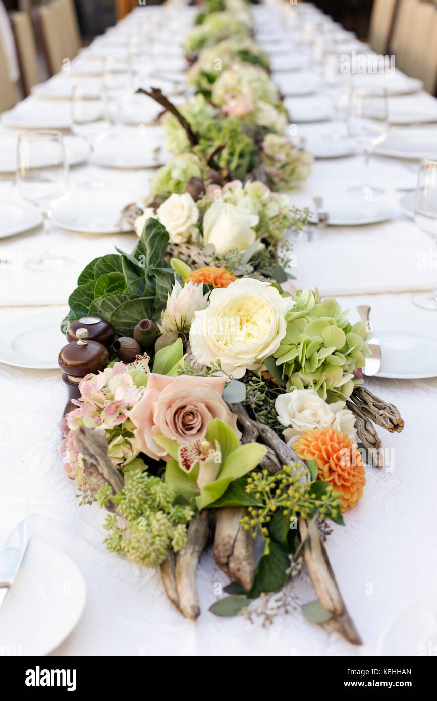 Row of flowers on table Stock Photo - Alamy