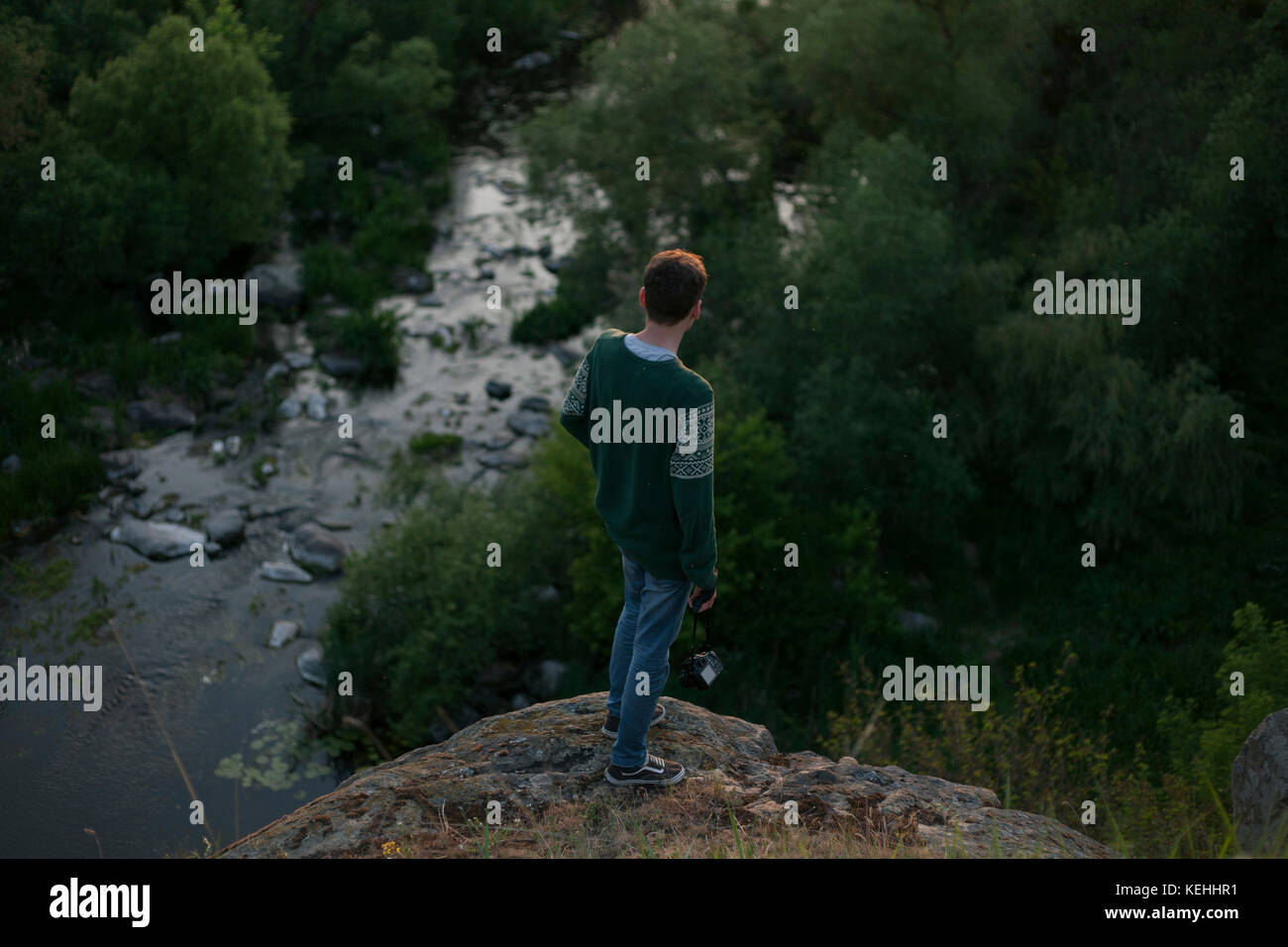 Man standing on a rock hi-res stock photography and images - Alamy