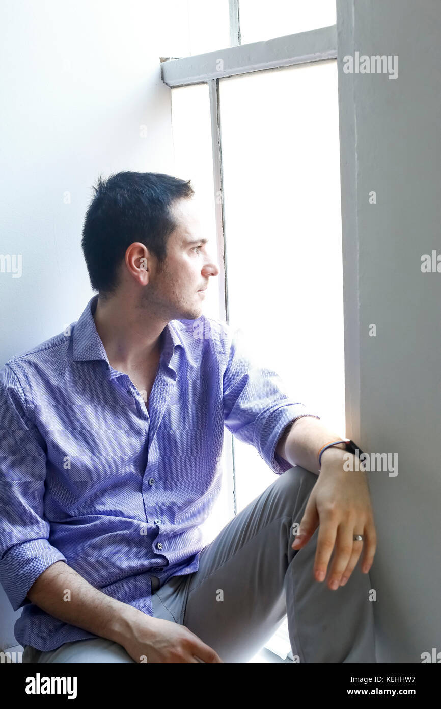 Side profile of a man sitting hi-res stock photography and images - Alamy