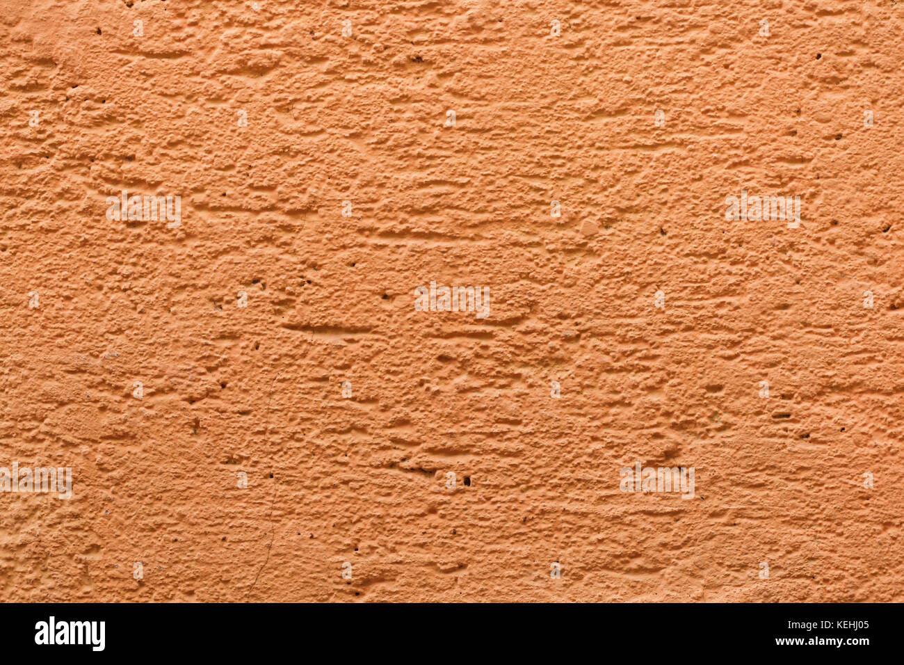 Yellow ochre painted stucco wall. Background texture Stock Photo - Alamy