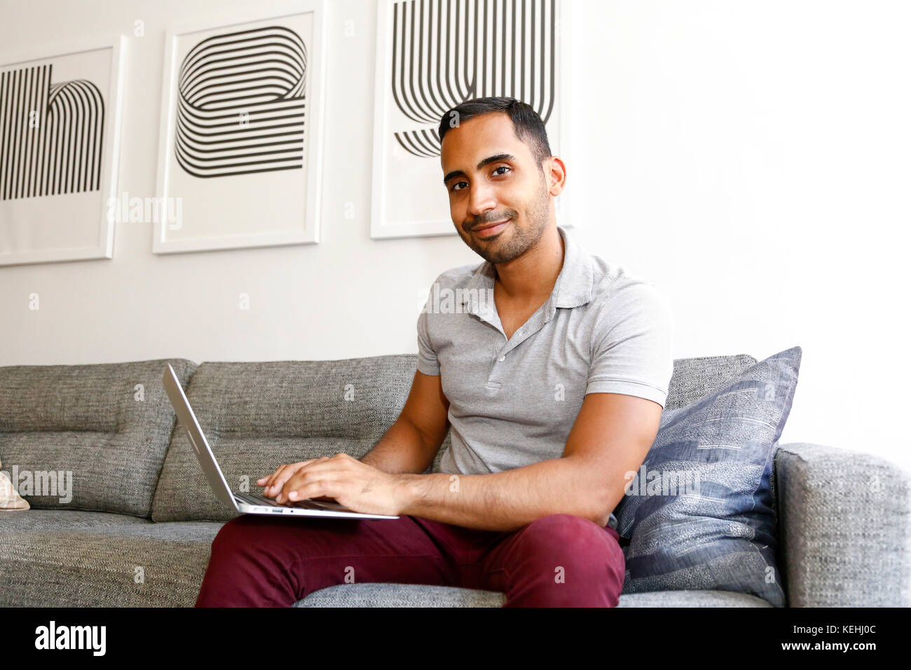 Young adult laptop sitting on hi-res stock photography and images - Alamy