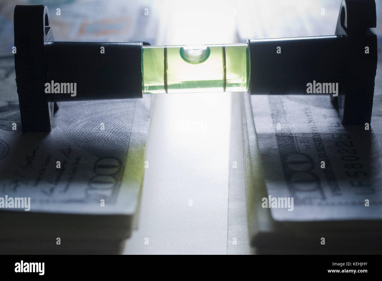 Level stacks of money Stock Photo - Alamy