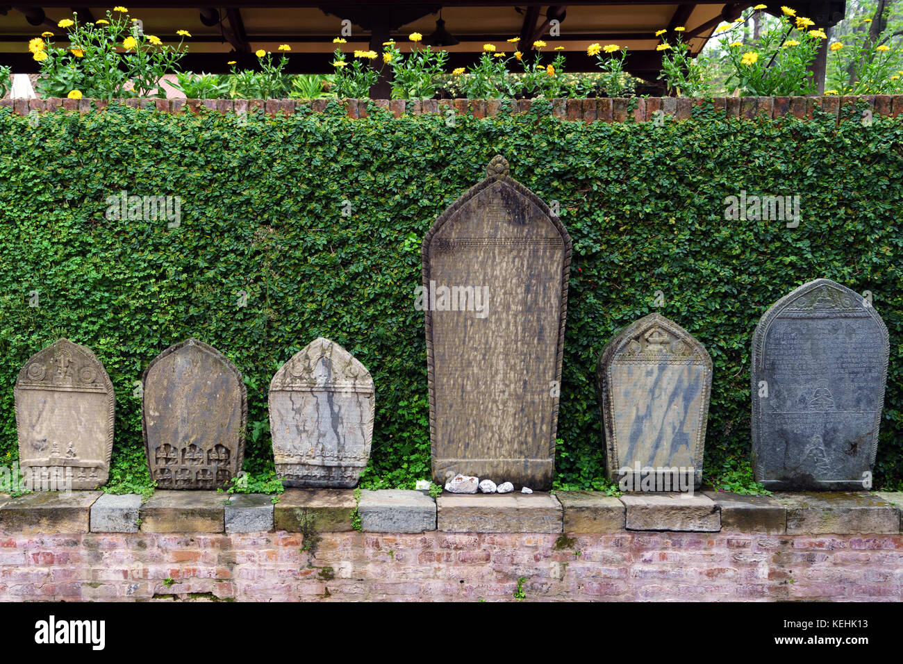 Ancient inscripted stone tablets in the gardens of Patan museum ...