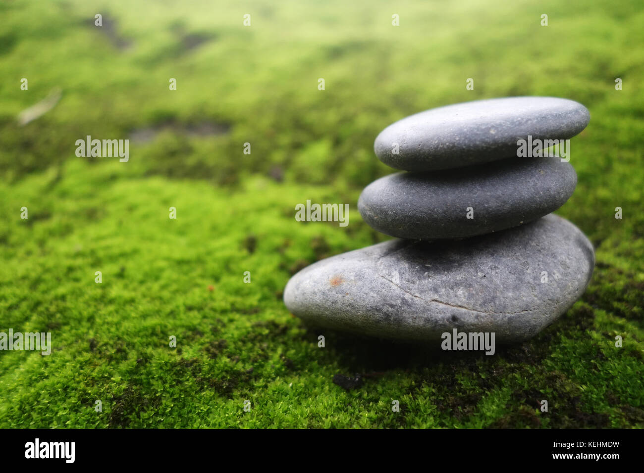 Stack of pebble stones in a forest Stock Photo - Alamy