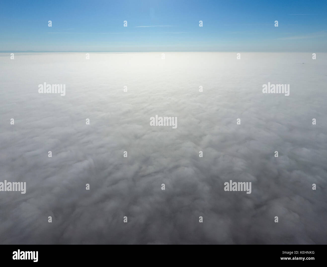 In the skies above the fog. Sunrise over the fog. Clouds near the ...