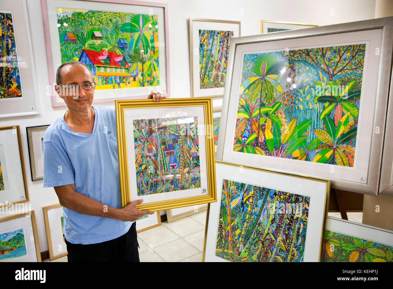 The Seychelles, Mahe, Baie Lazare, artist Gerard Devoud in his gallery ...