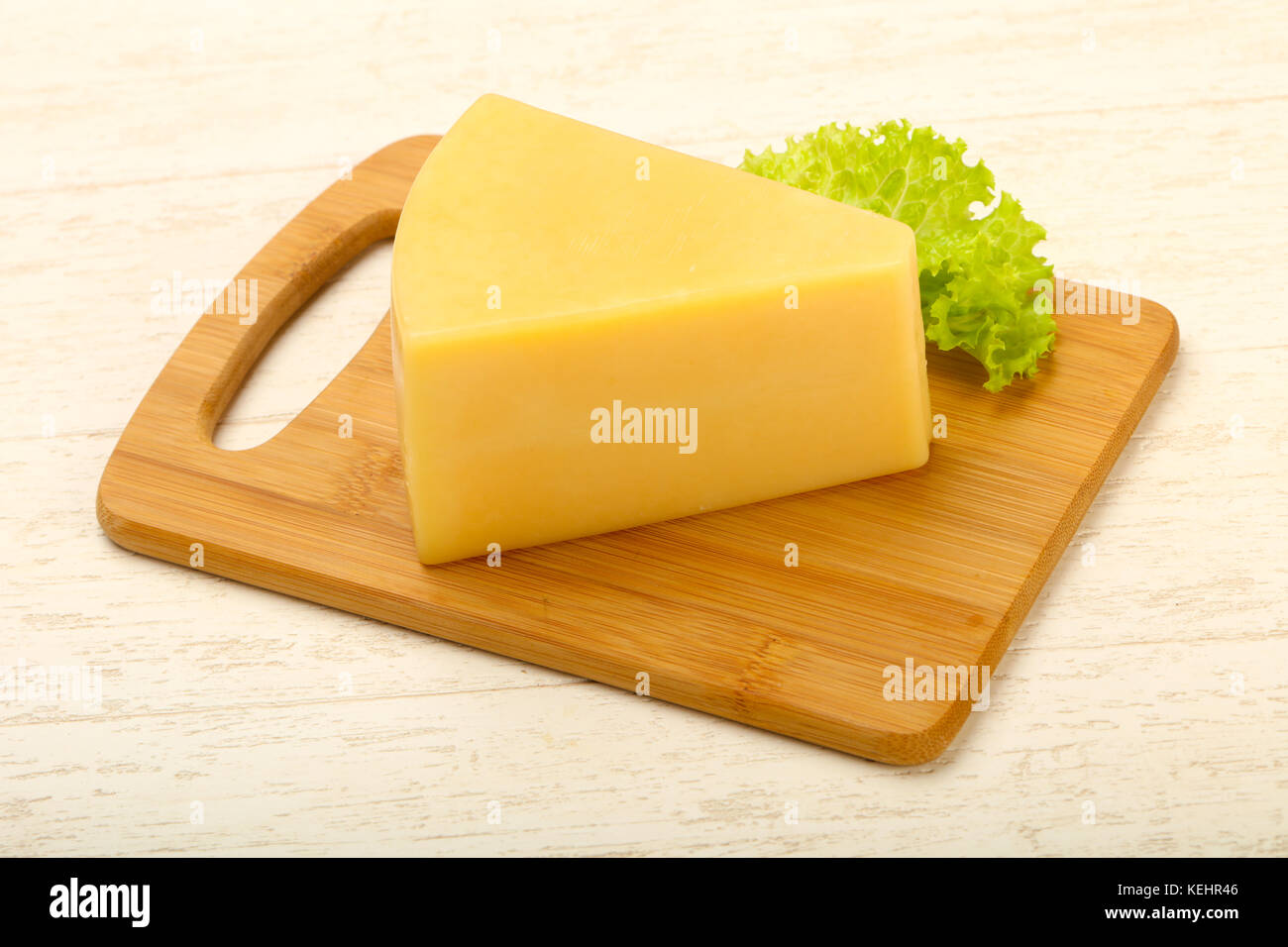 Parmesan cheese triangle Stock Photo - Alamy