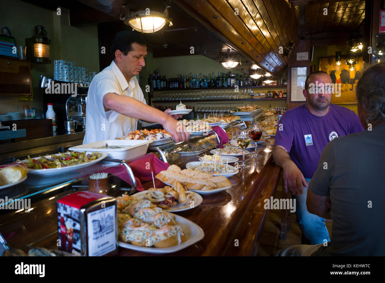 People eating tapas bar in hi-res stock photography and images - Alamy