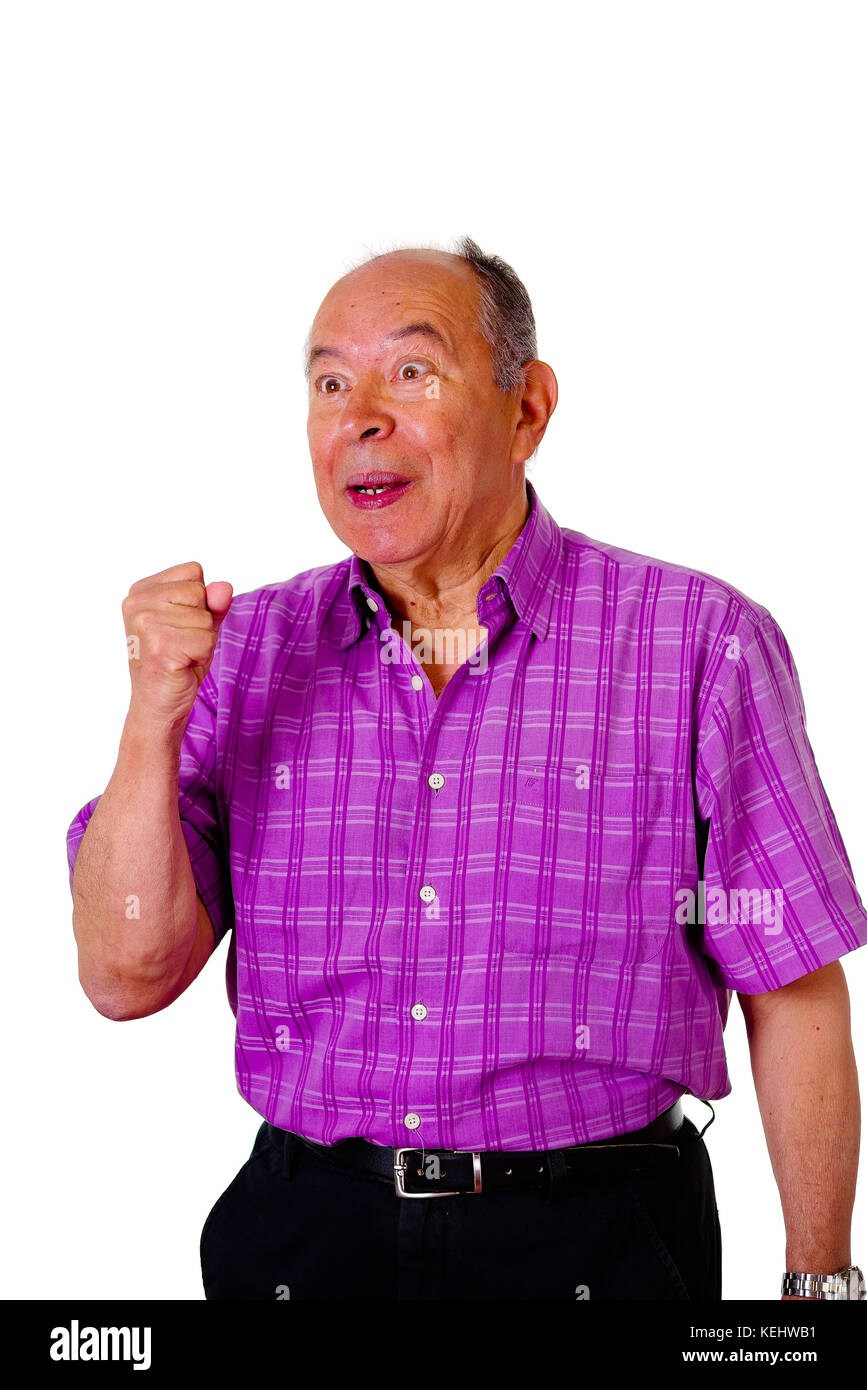 Portrait of a surprised and happy mature man, doing a fist sign of ...