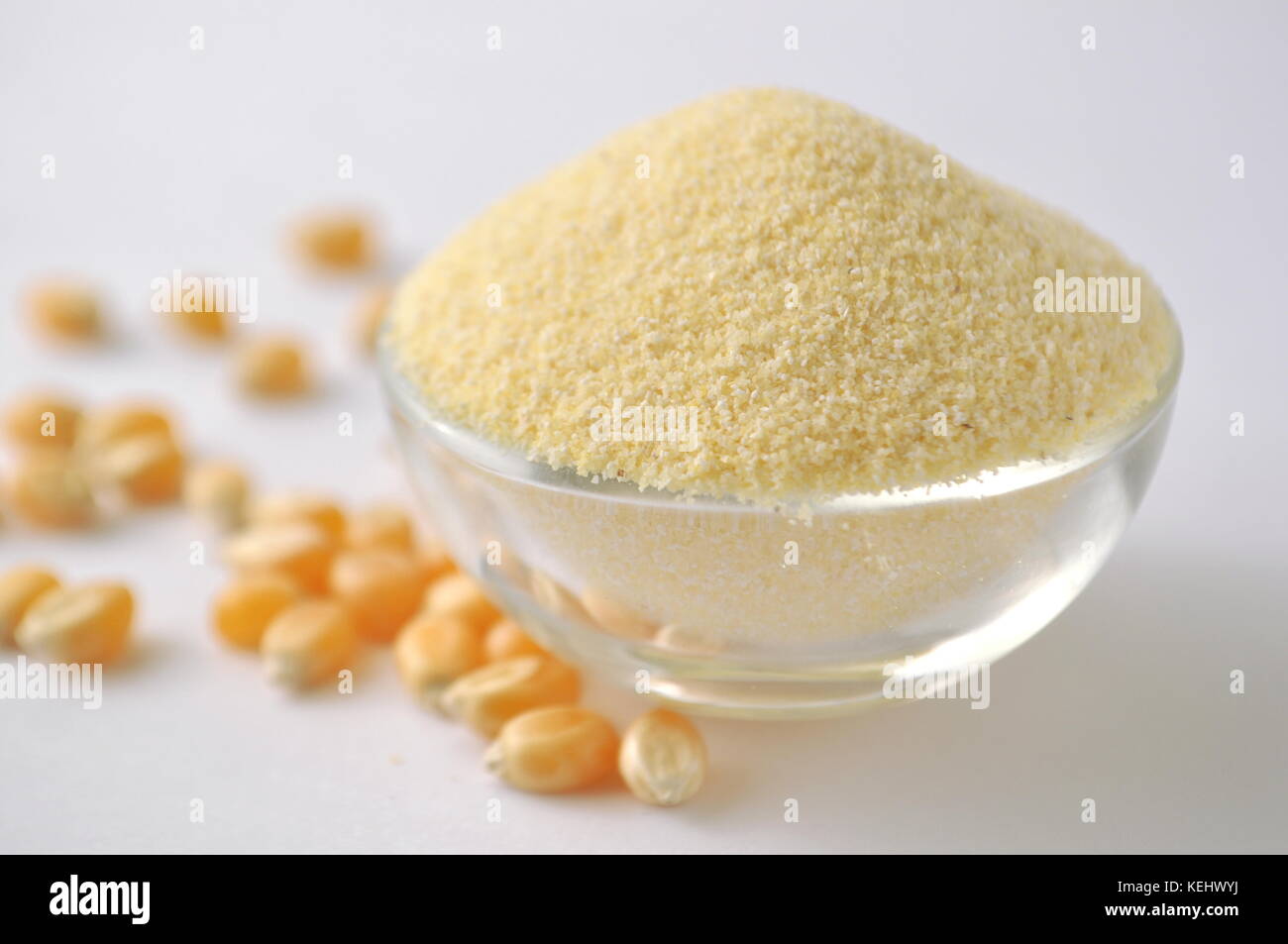 Corn flour and grains on white background. Isolated on white. Yellow ...