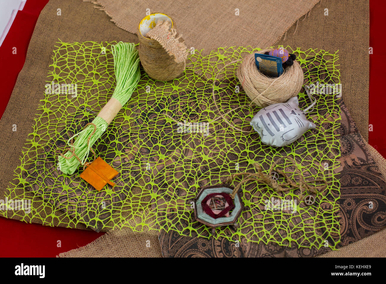 Sewing textile or cloth. Gold scissors pin cushion, and natural white ...