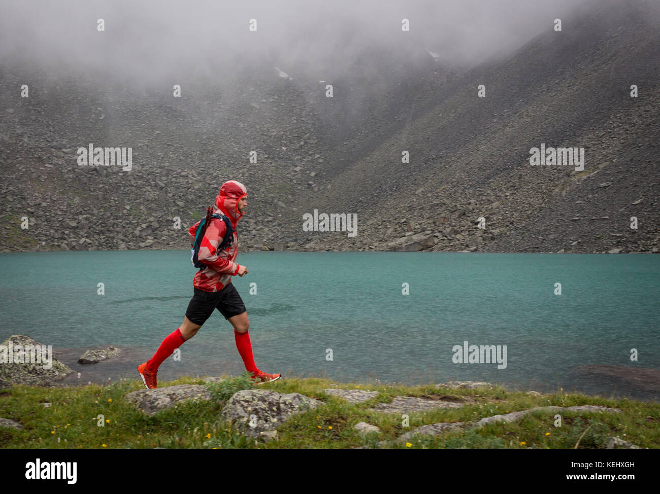 Man trail running in the mountain in Altai, Russia Stock Photo - Alamy