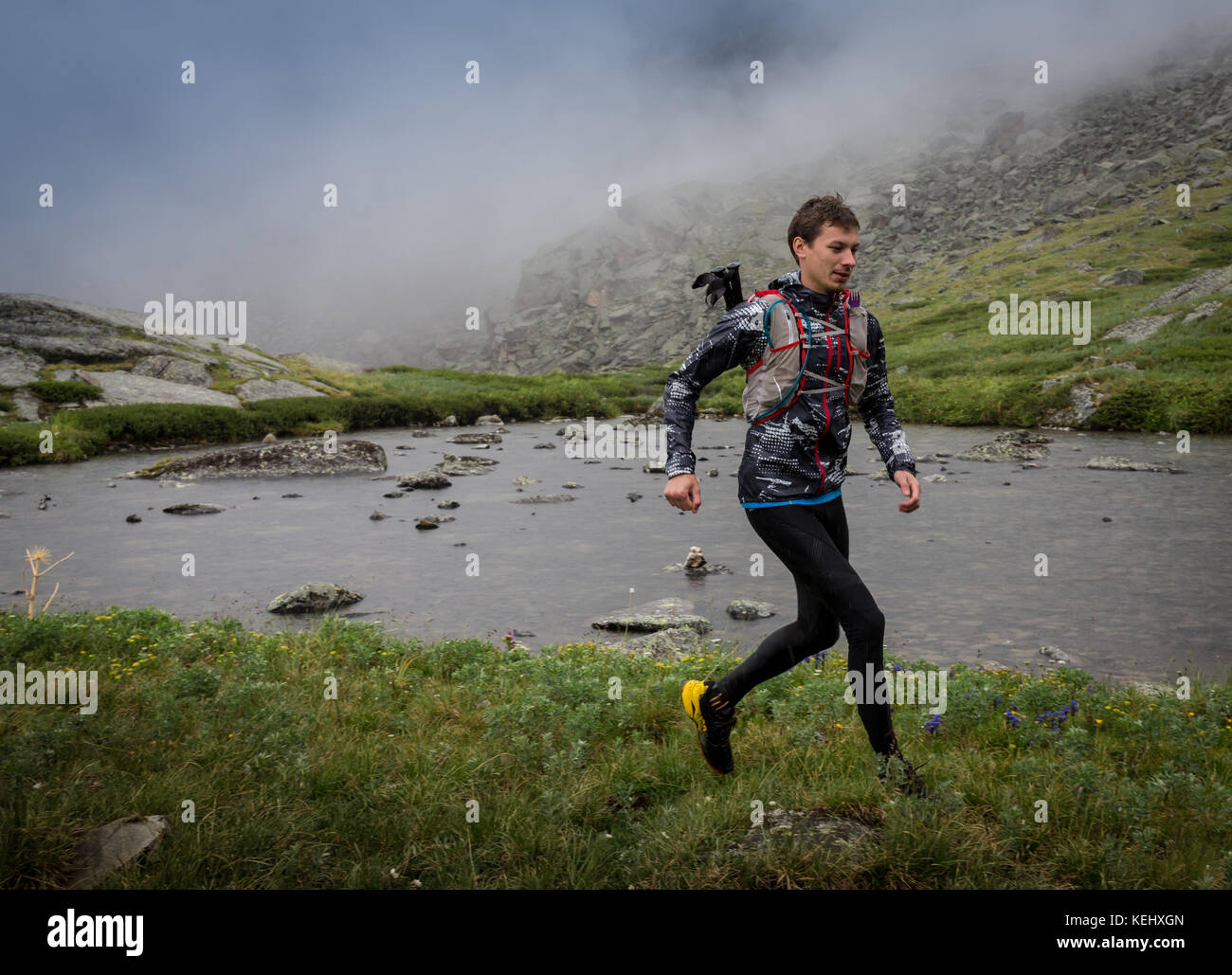 Man trail running in the mountain in Altai, Russia Stock Photo - Alamy