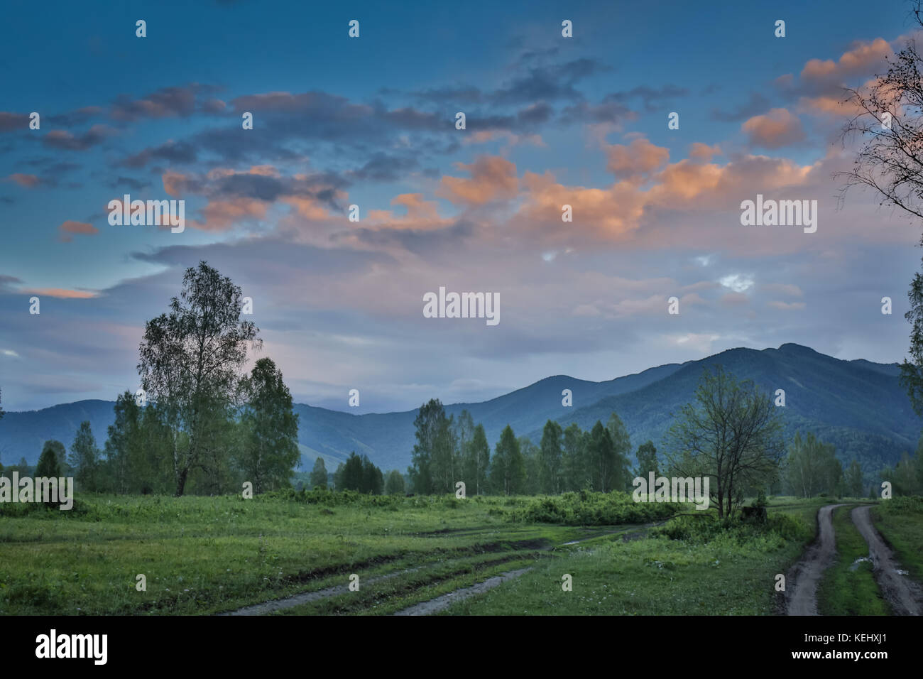 Beautiful dramatic sunset in the mountains. Landscape with sun light ...