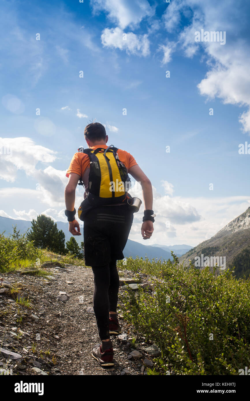 Man trail running in the mountain in Altai, Russia Stock Photo - Alamy