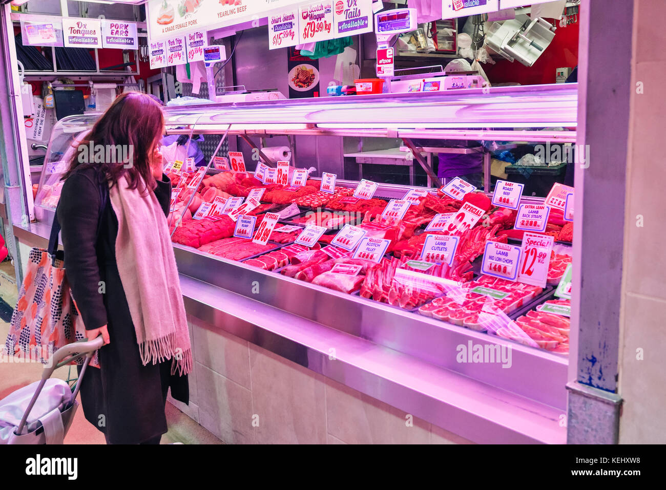 Australia Melbourne, Queen Victoria Market. A customer look at the ...