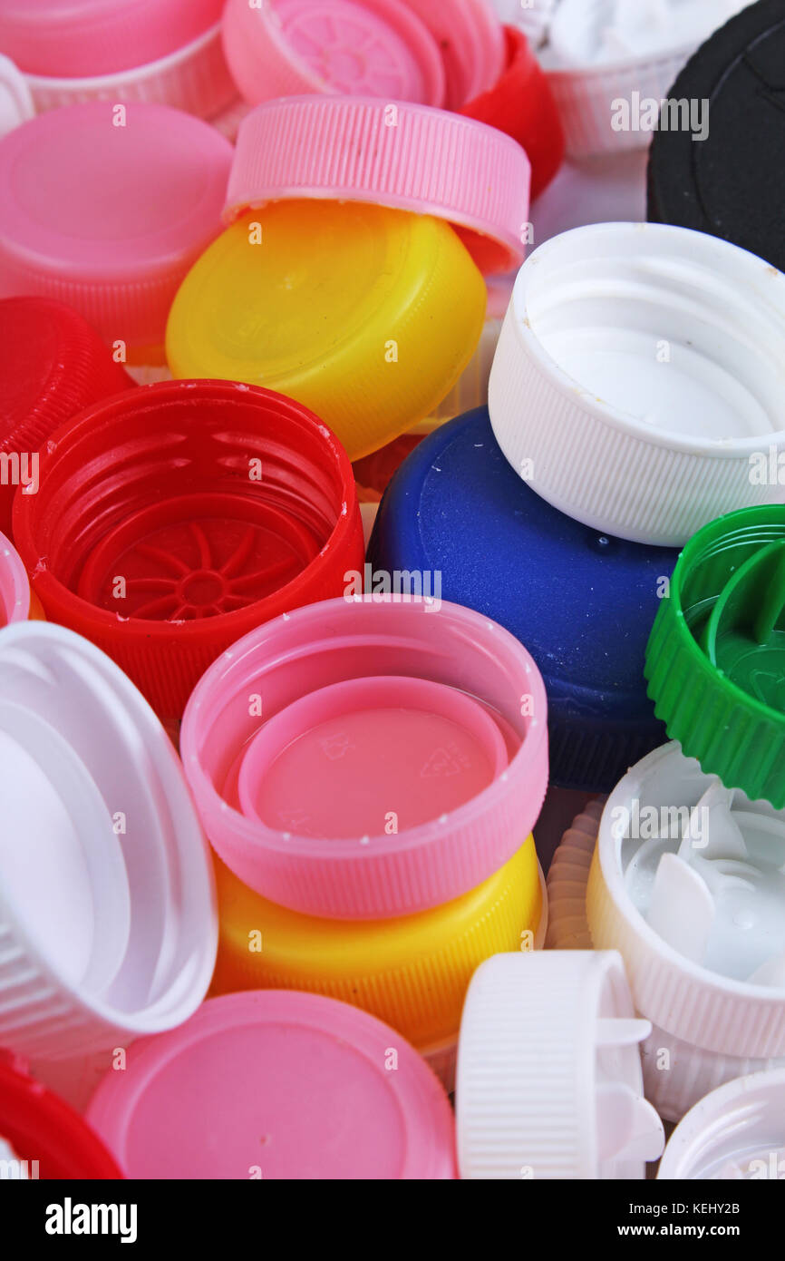 Plastic bottle caps. Close-up shot of stack of recyclable plastic ...