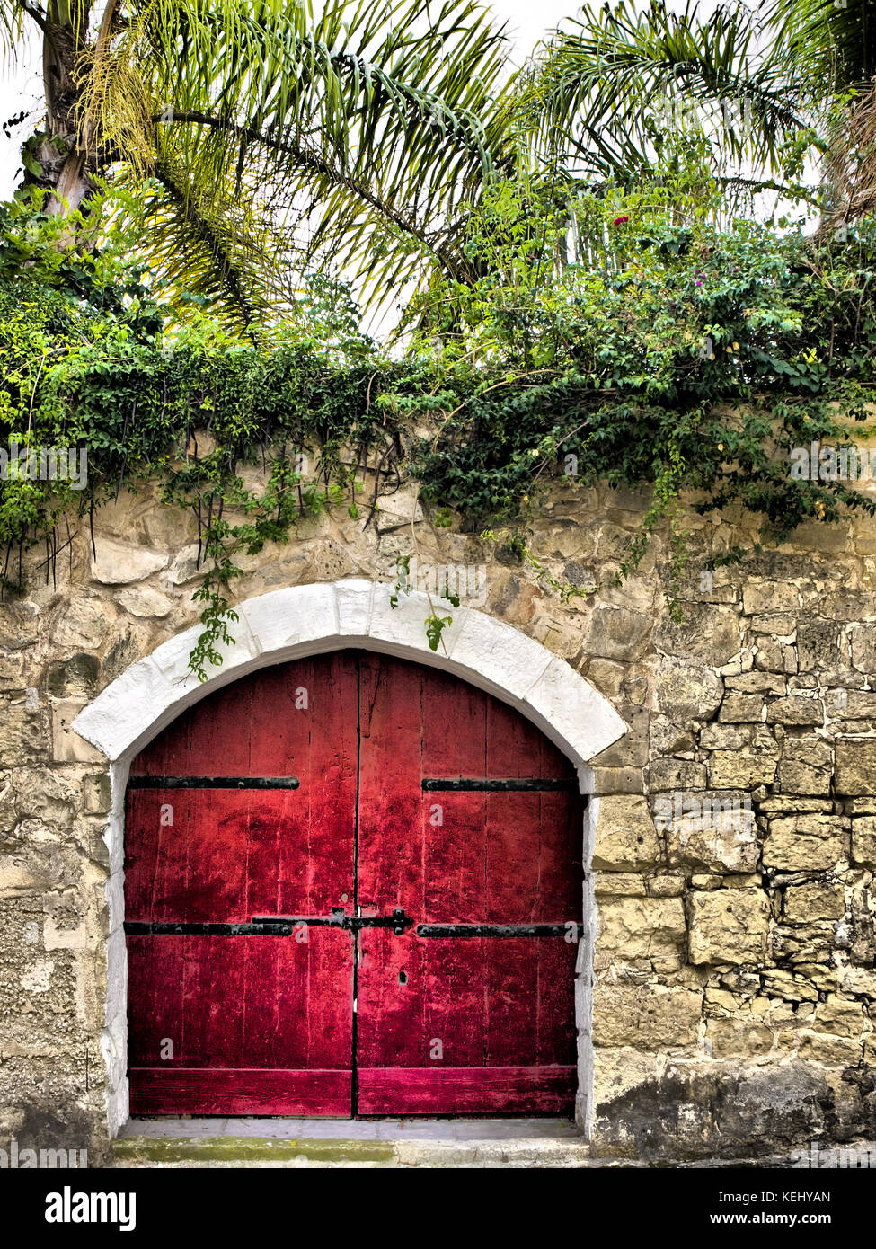 Red medieval garden door rich in texture Stock Photo - Alamy