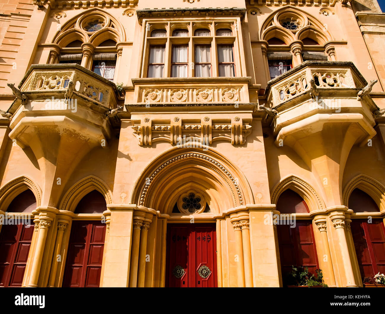 A medieval limestone facade in traditional Gothic style in Mdina on the ...