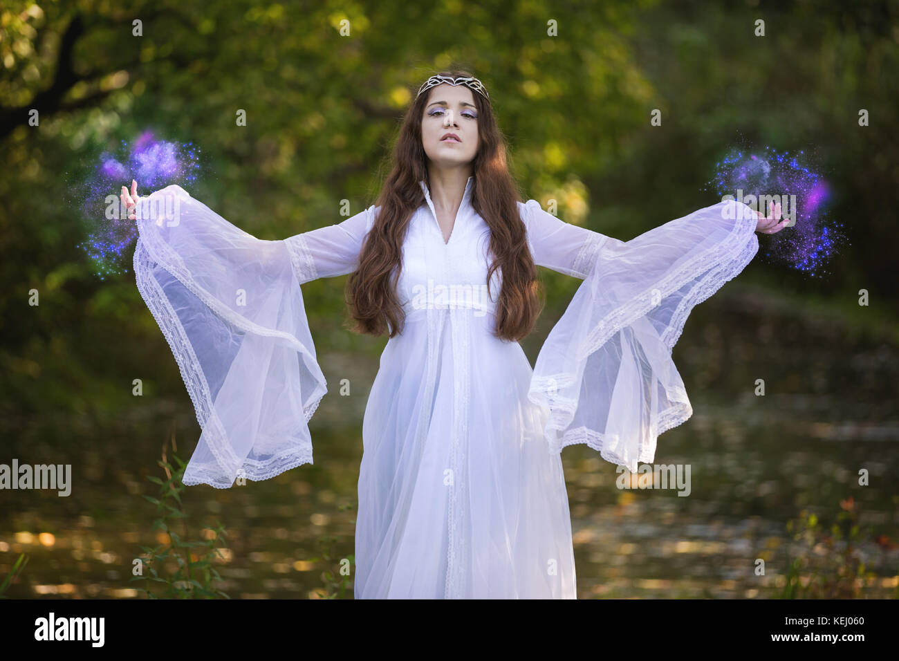 Sorcerer practicing magic in the forest Stock Photo - Alamy