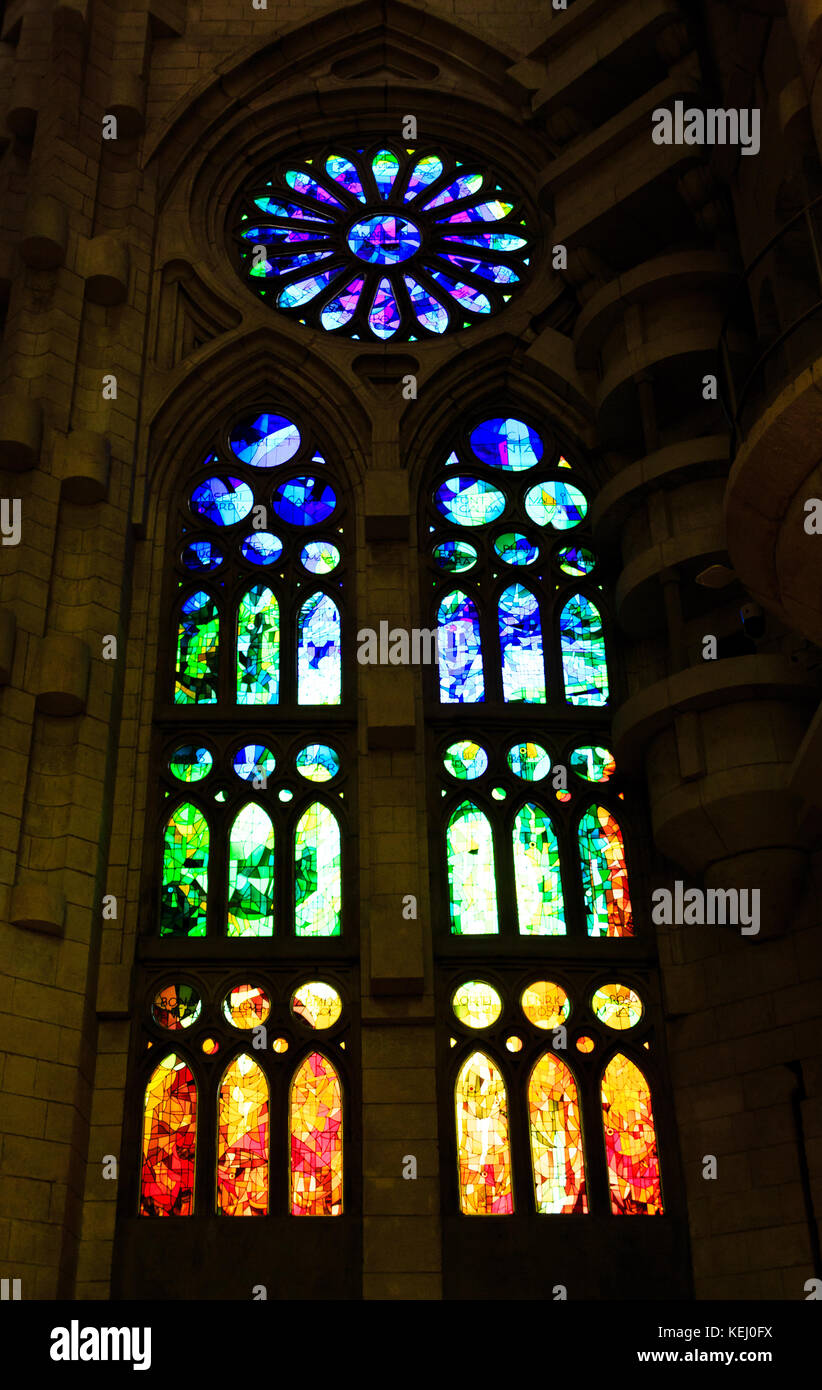 Brightly colored stained glass windows in a dark church Stock Photo - Alamy