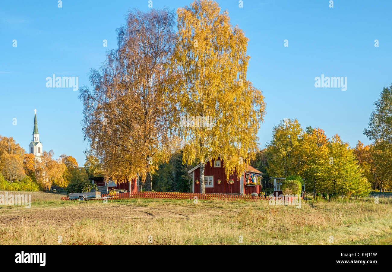 Autumn in Sweden - traditional red cottage in the countryside of ...