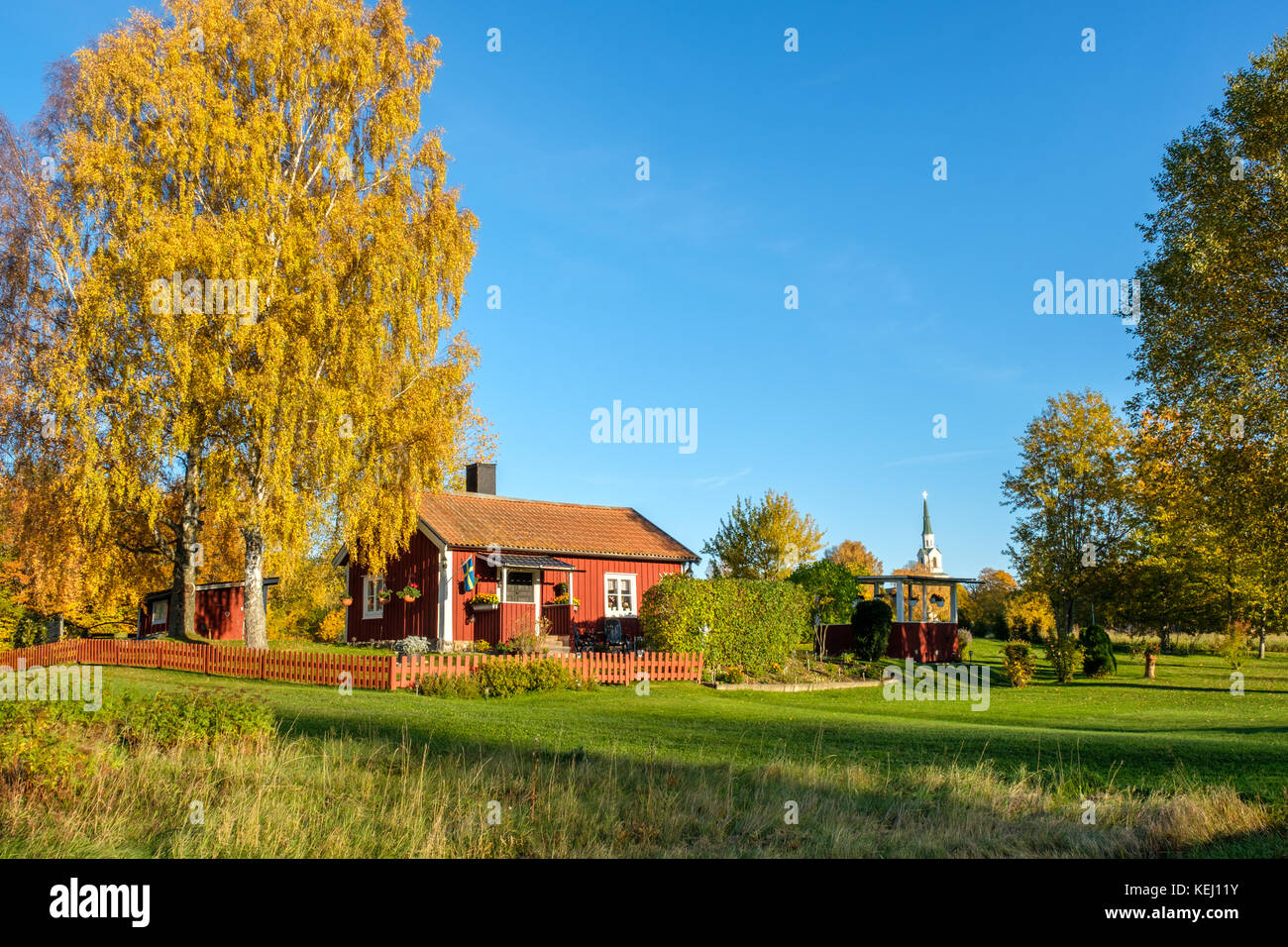 Autumn in Sweden - traditional red cottage in the countryside of ...
