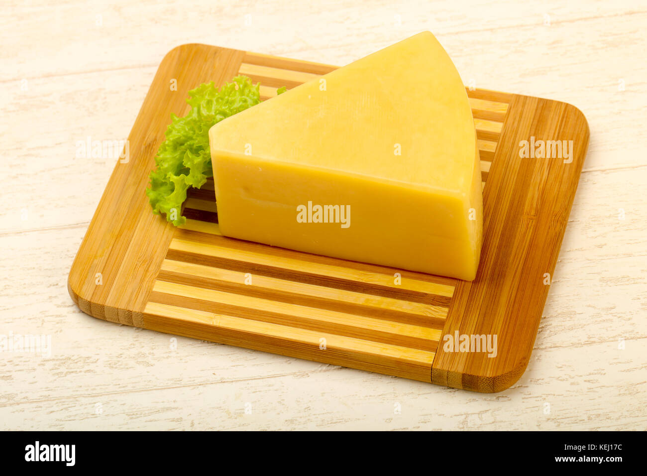 Parmesan cheese triangle Stock Photo - Alamy