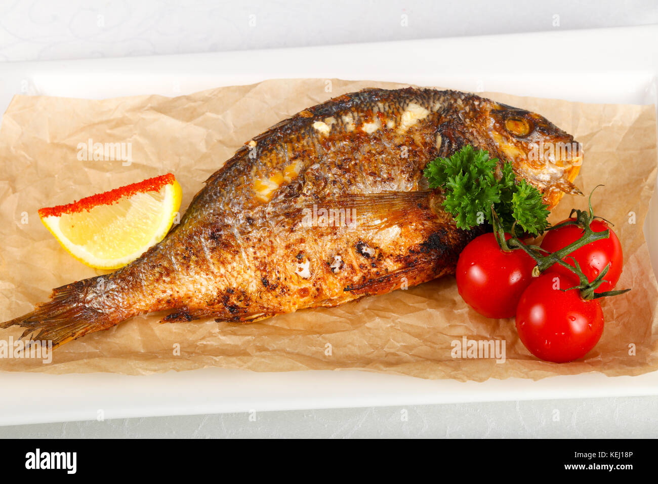 Roasted dorada fish Stock Photo - Alamy