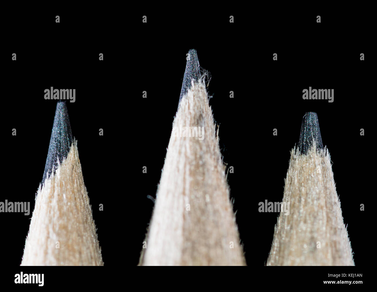 A macro shot of three pencils shot against a black background Stock ...
