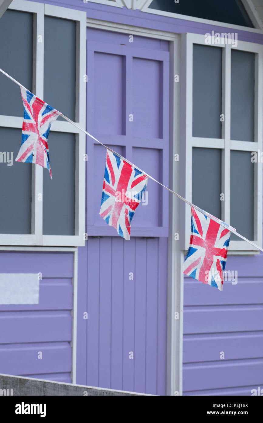 Union flags draped outside an English seaside chalet in a deserted ...