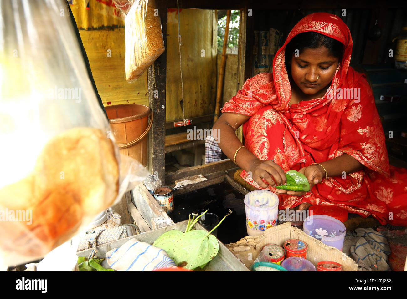 Poor Rural Woman in Her Tea Shop in Dhaka Stock Photo - Alamy