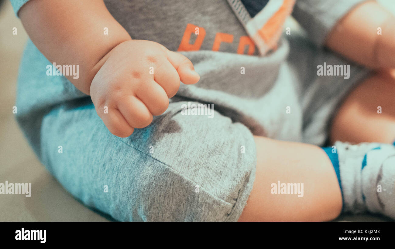 Lower body part of a sitting baby Stock Photo - Alamy