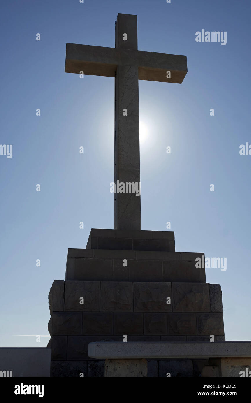 christian symbol against the sun with blue sky Stock Photo - Alamy
