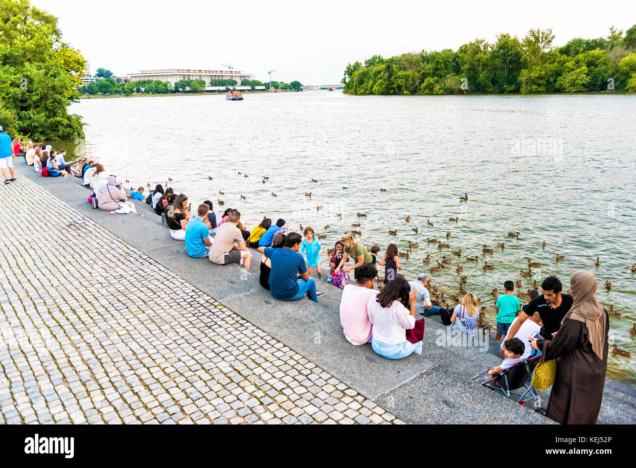 Washington DC, USA - August 4, 2017: People sitting on steps in ...