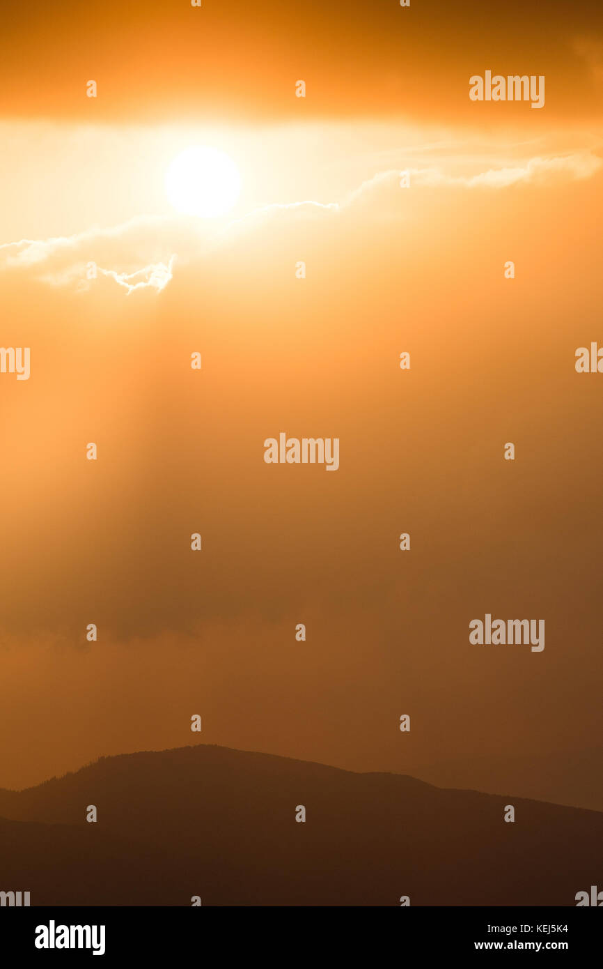 Sun shining through the gap between clouds Stock Photo - Alamy