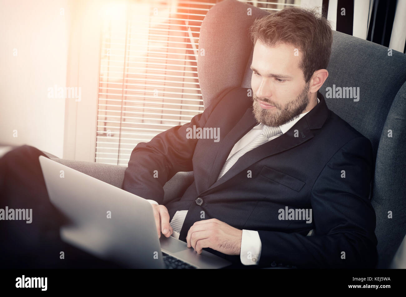 Young business man working from home with laptop. home computer ...