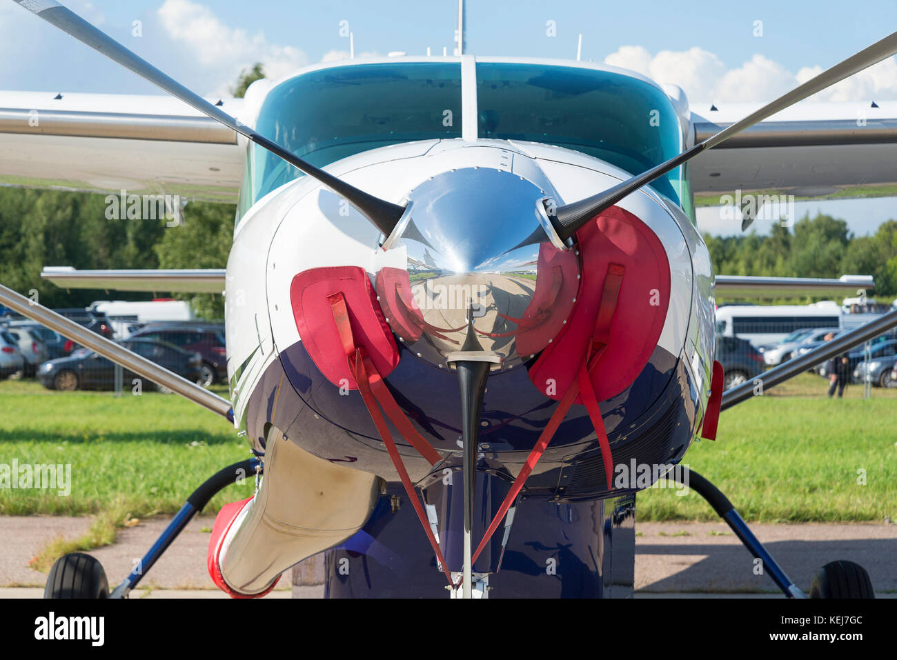 Propeller plane parked on the airfield - front close up view against ...