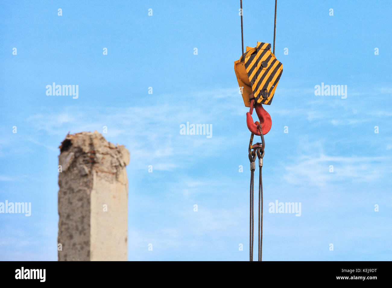 Yellow lifting hook on the cable, with a free place for the inscription ...