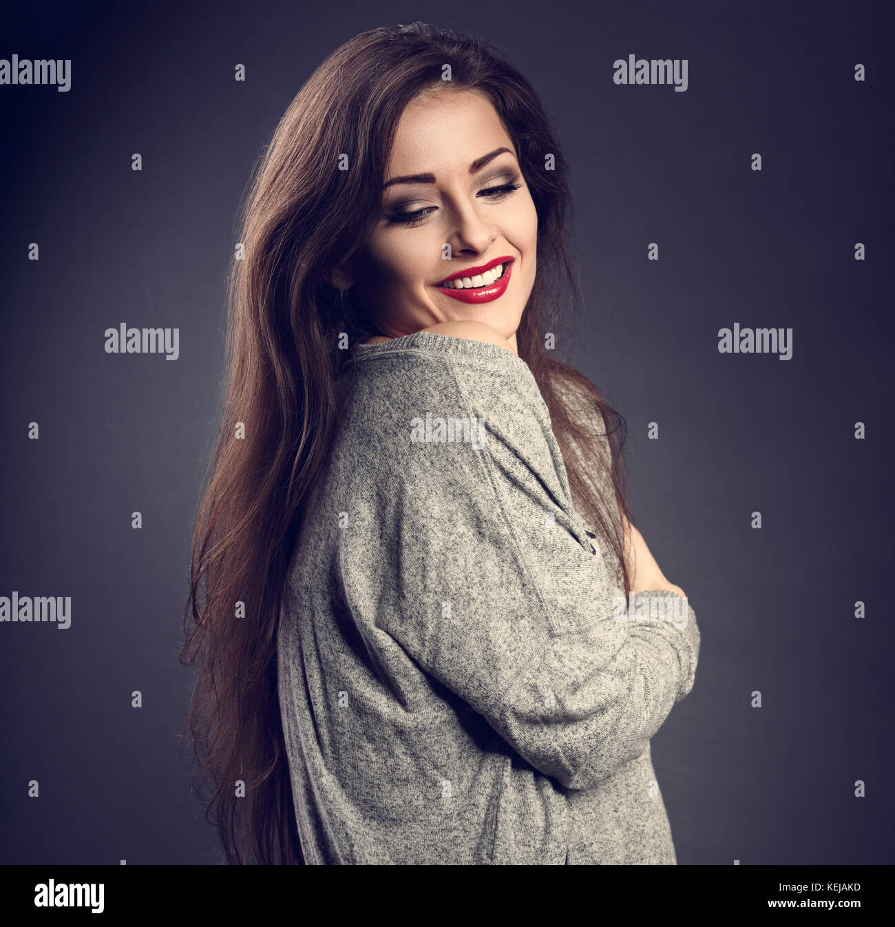 Happy beautiful makeup woman hugging herself with natural emotional ...