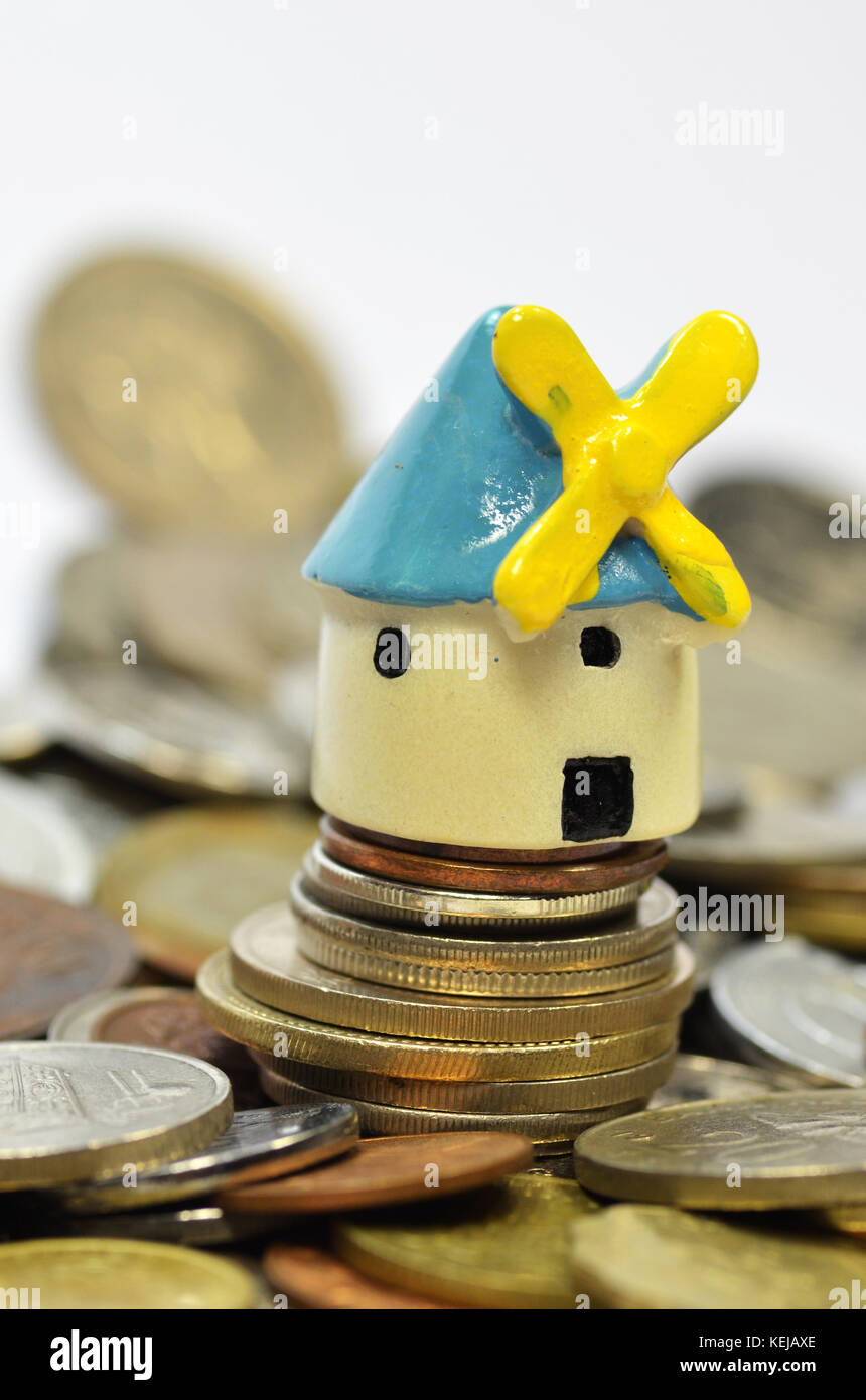 Mortgage concept by money house from coins Stock Photo - Alamy