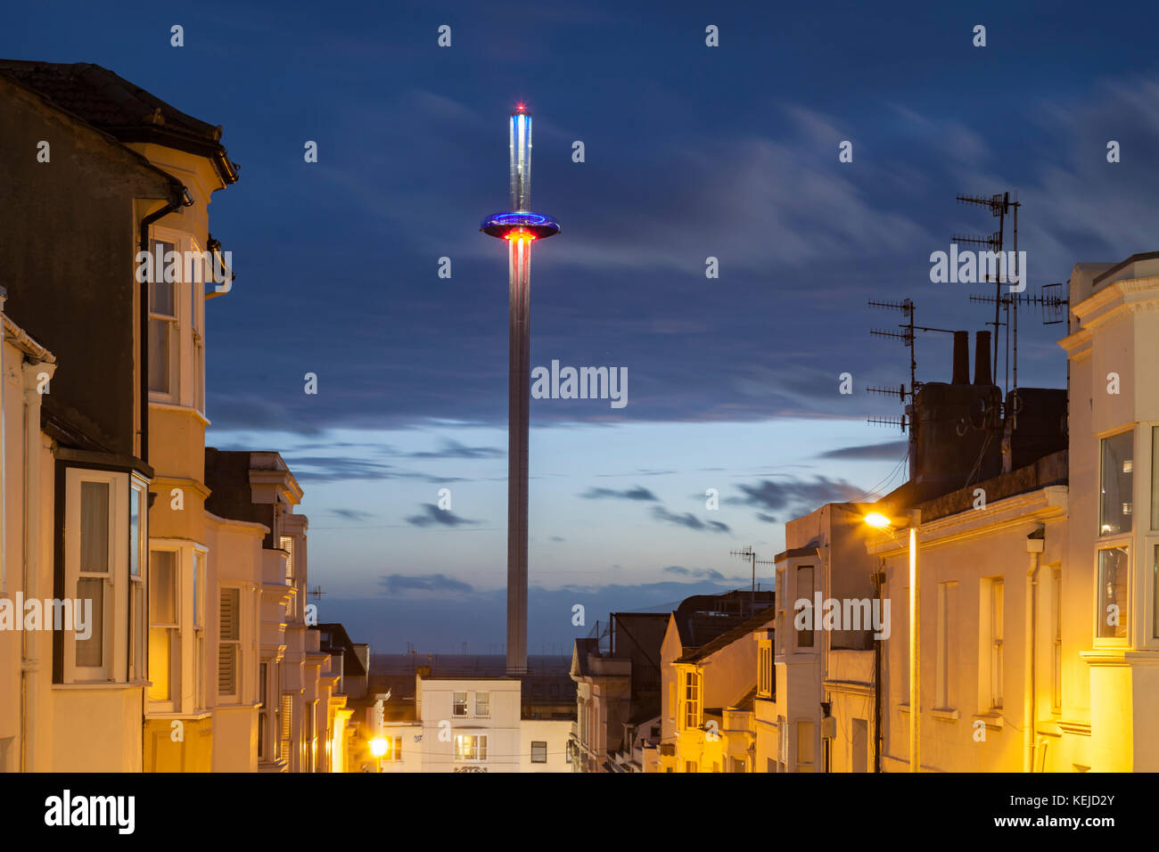 Night falls in Brighton city centre, East Sussex, England. i360 tower ...