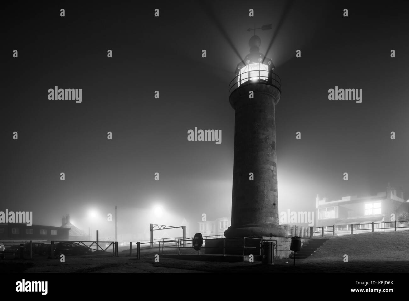 Lighthouse in the fog Black and White Stock Photos & Images - Alamy