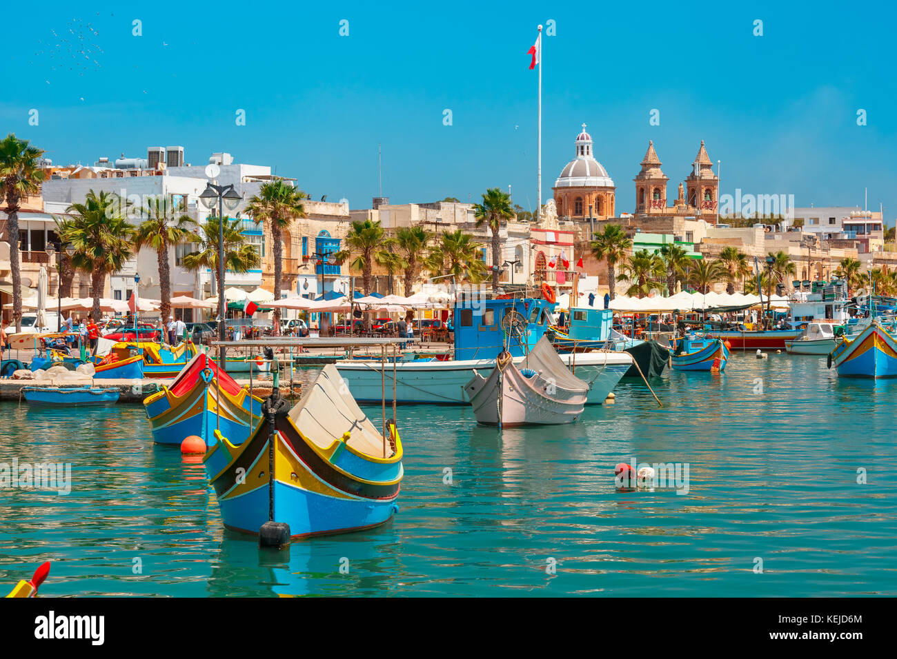 Traditional eyed colorful boats Luzzu in the Harbor of Mediterranean ...