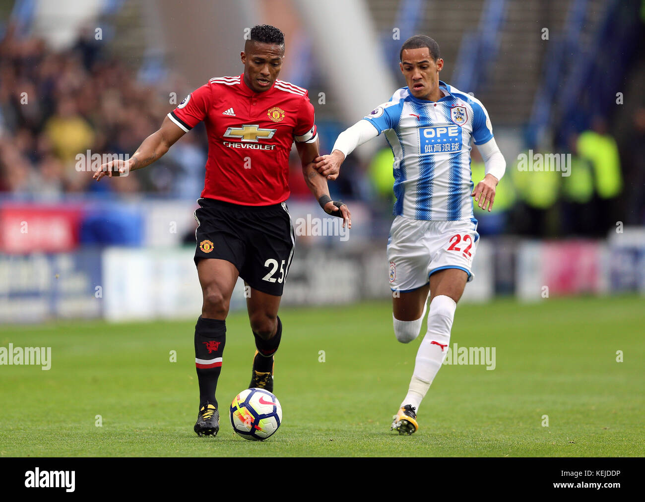 Manchester United's Antonio Valencia (left) and Huddersfield Town's Tom ...