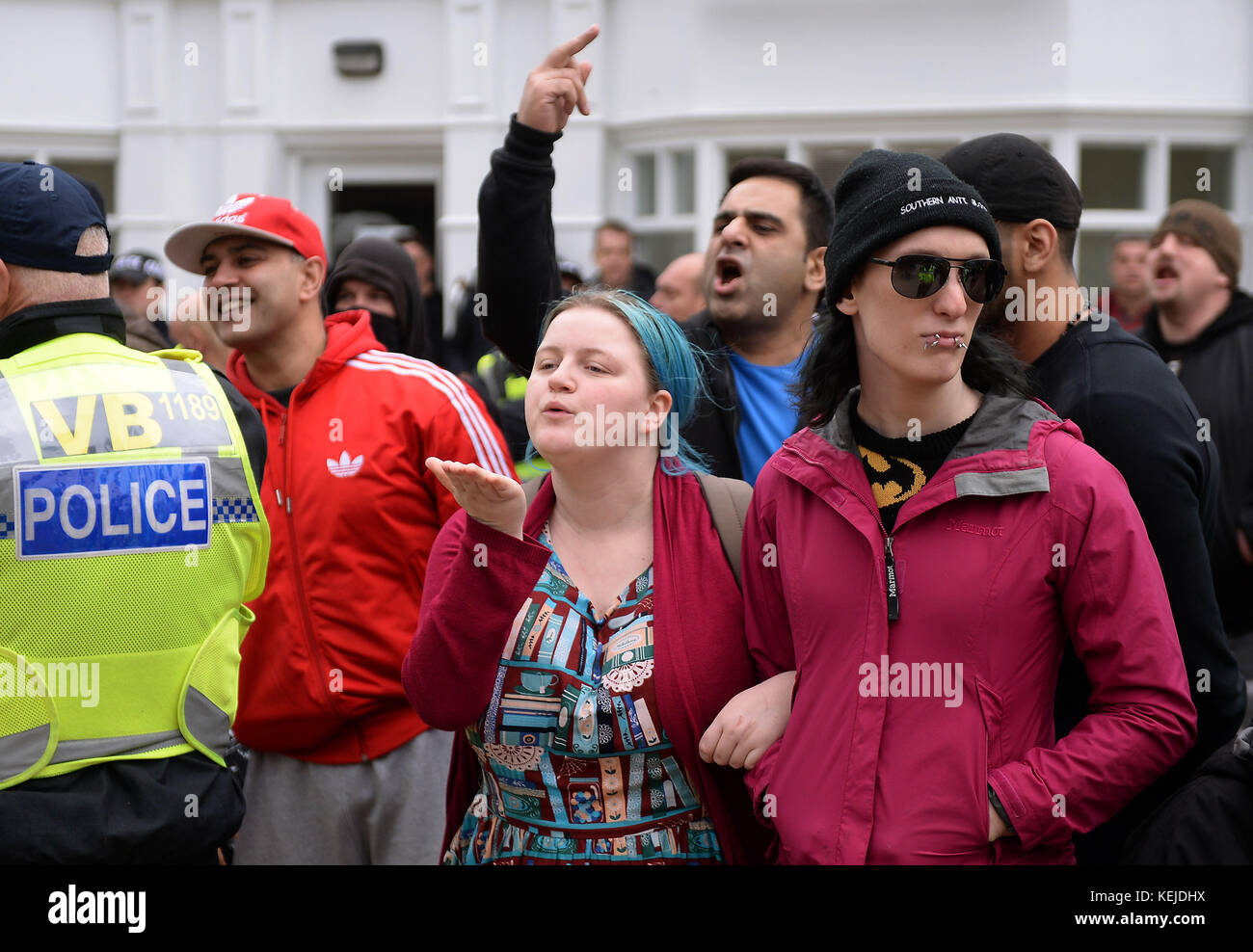 Note gesture A woman blows a kiss during a counter protest as the far ...