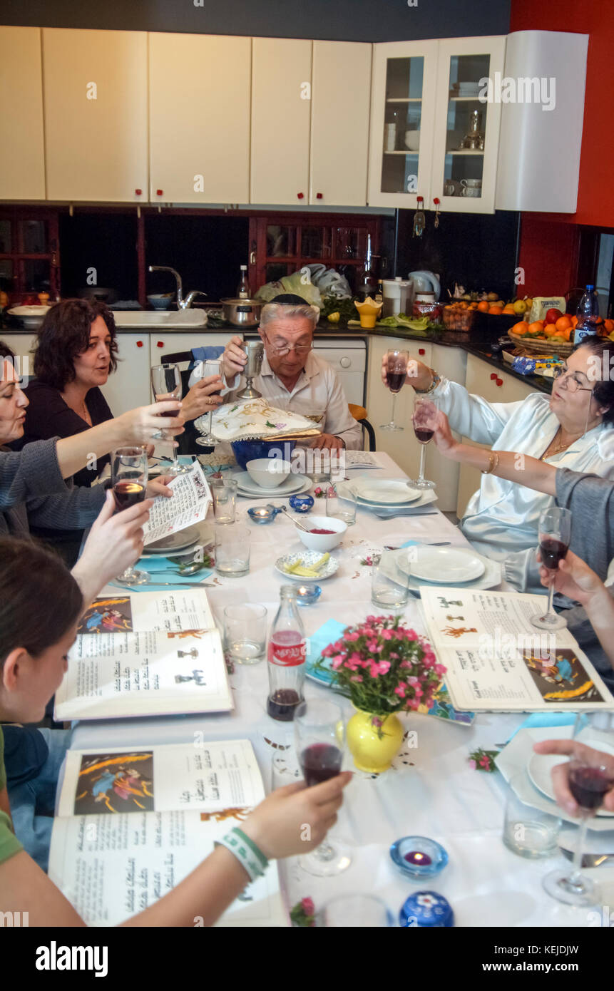 family around the Traditional sedder table set for a Jewish Festive ...