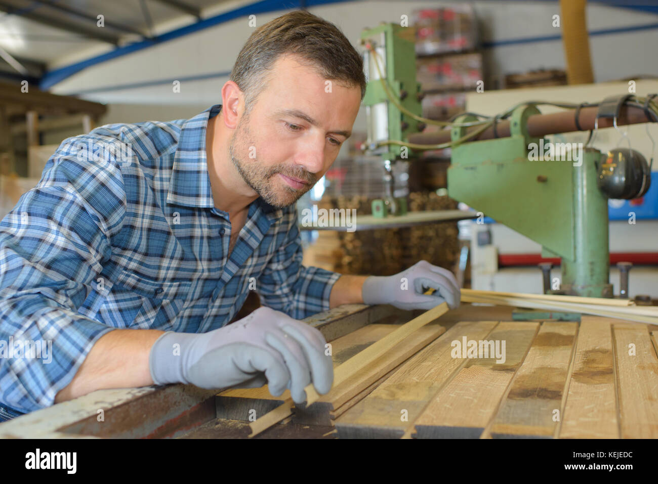 sawmill employee working with wood tools and machinery Stock Photo - Alamy
