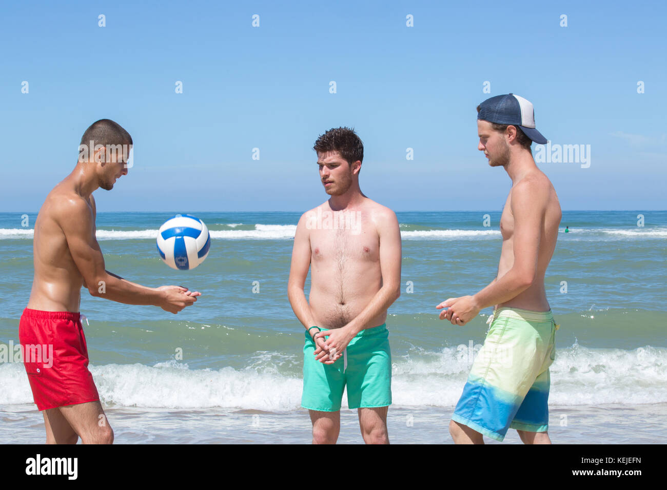 joyful friends playing volleyball Stock Photo - Alamy