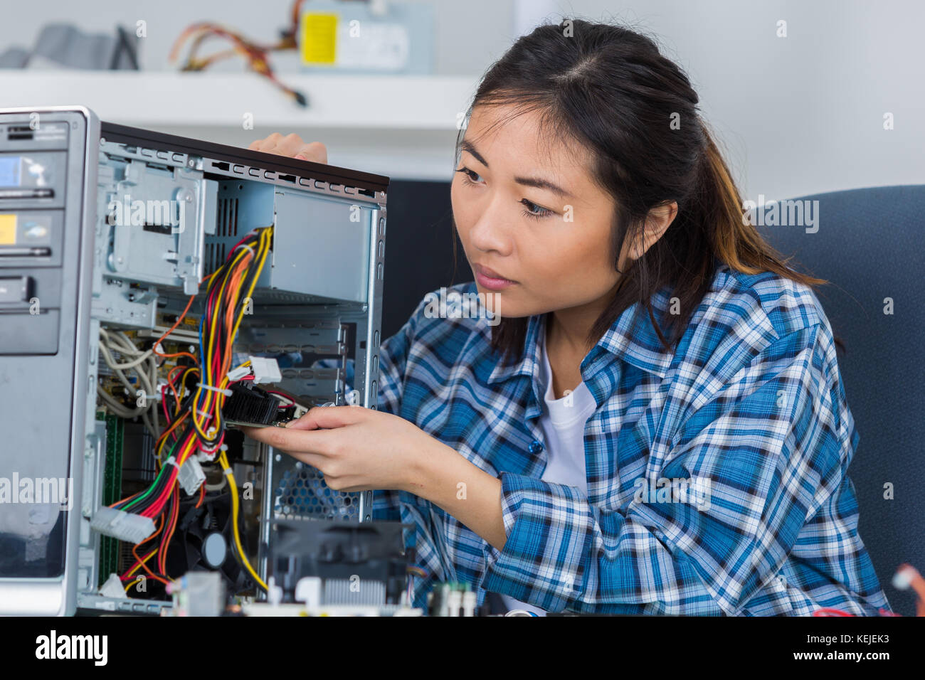 asian lady repairing computer Stock Photo - Alamy
